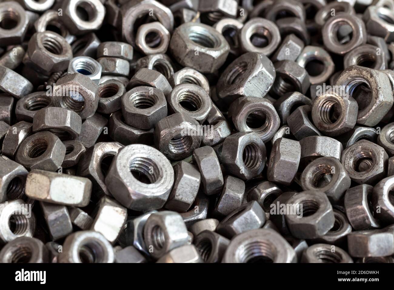 Rusty steel nuts of various sizes Stock Photo - Alamy
