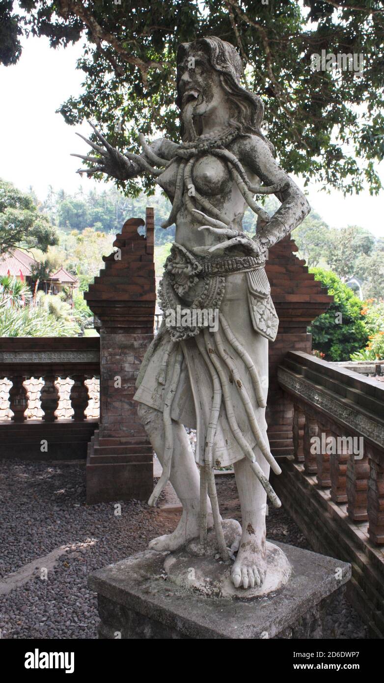 Balinese stone statue of demon on a pedestal at Titra Gangga, Water ...
