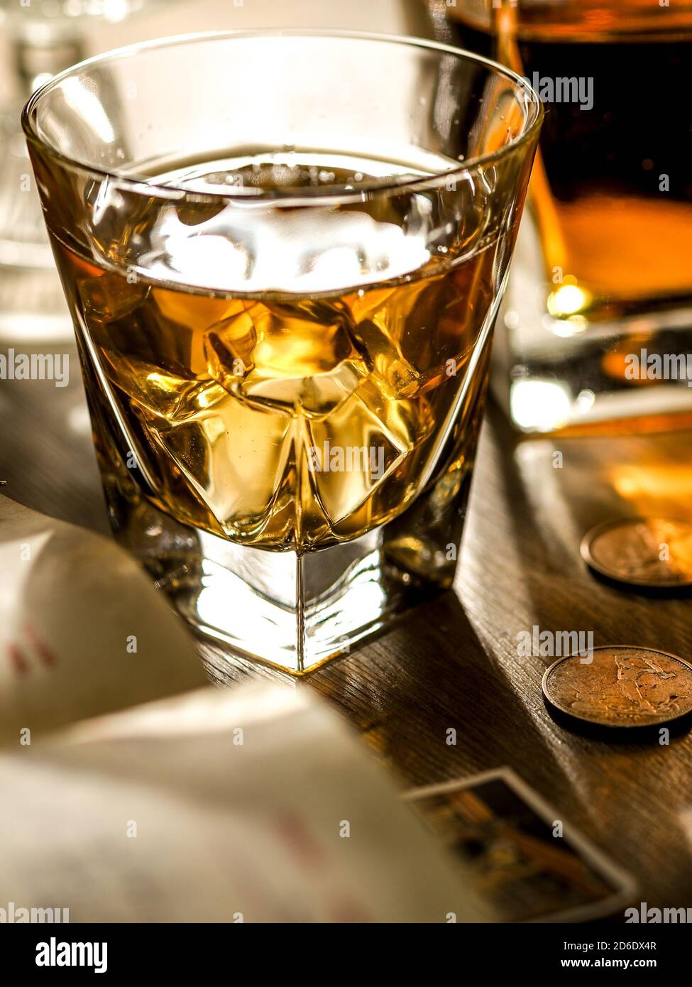 Glass of whisky, books and diary late at night Stock Photo - Alamy