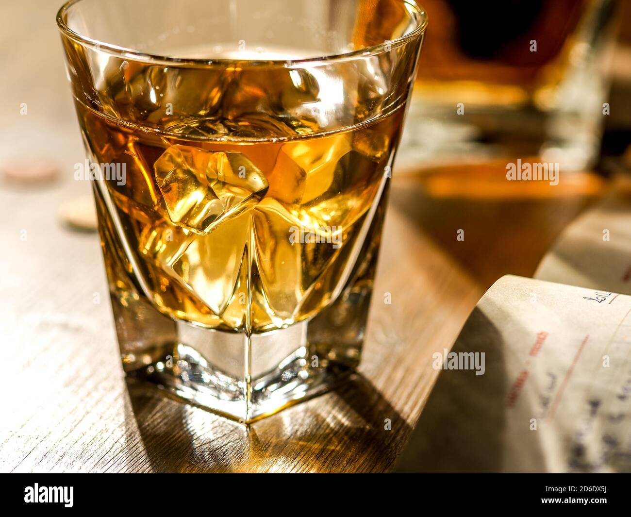 Glass of whisky, books and diary late at night Stock Photo - Alamy