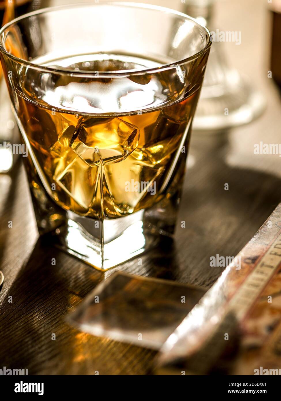 Glass of whisky, books and diary late at night Stock Photo - Alamy