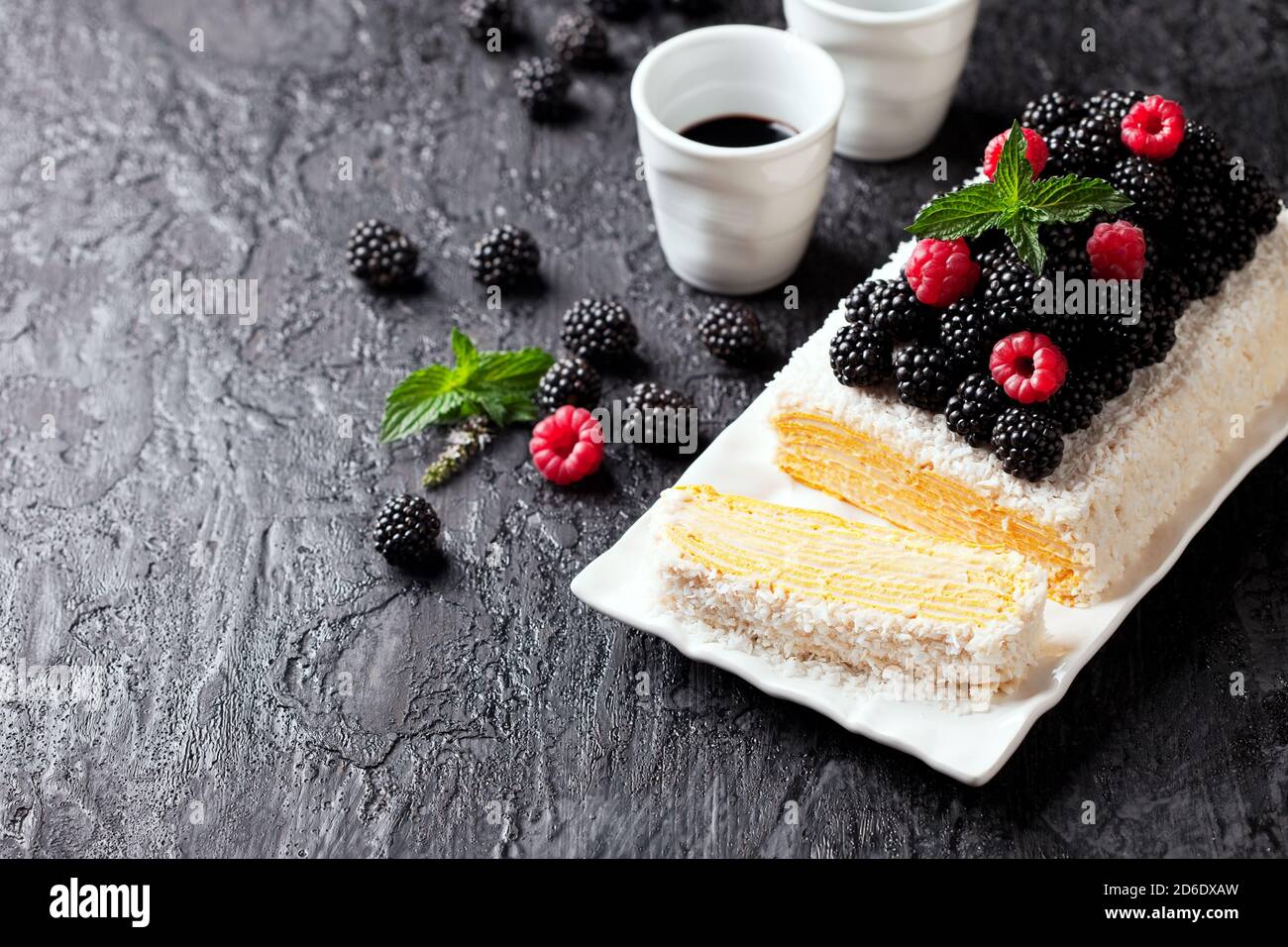 Napoleon cake with lemon cream and berries, selective focus Stock Photo ...