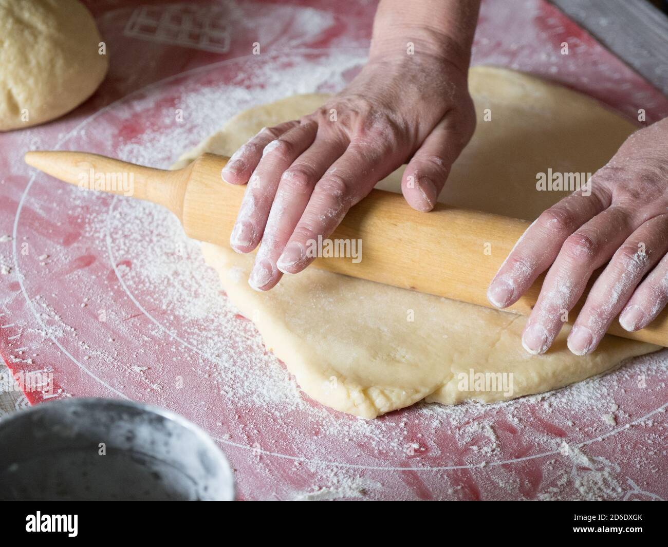 Woman's hands rolling dough, cooking at home Stock Photo - Alamy
