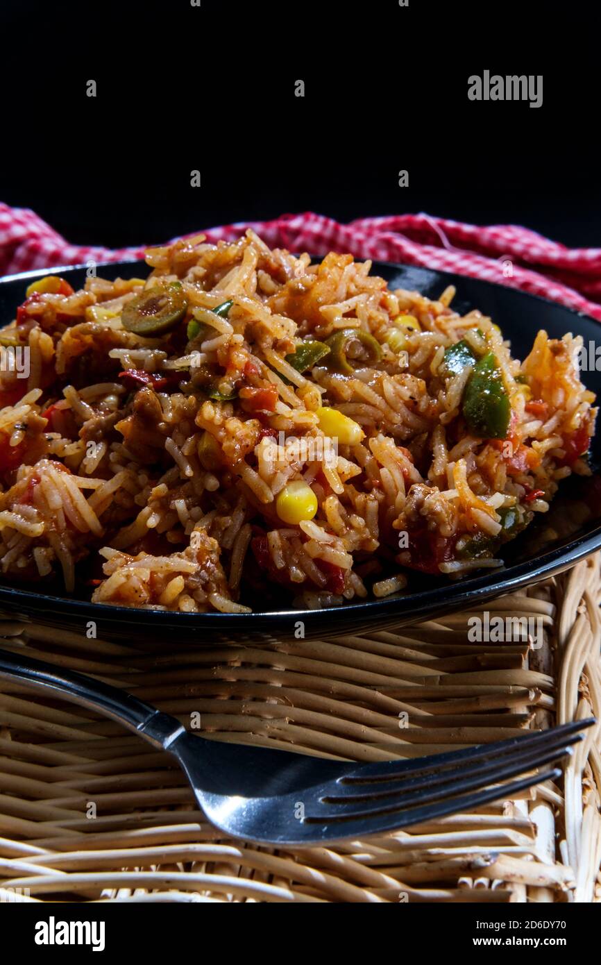 Spanish rice made with sausage mixed peppers onions corn and green ...