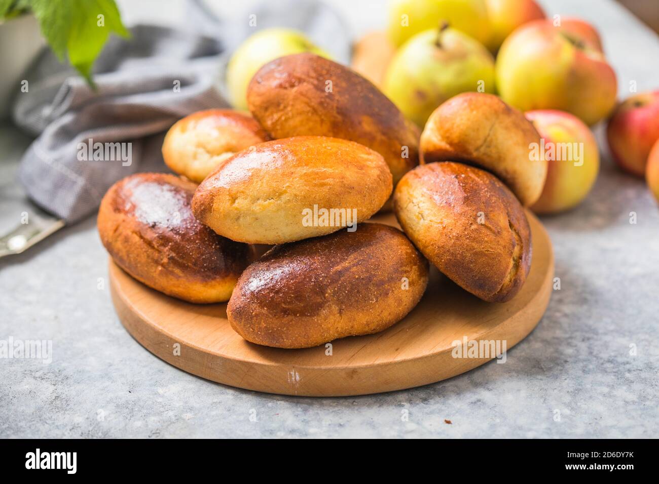 Ready-made baked pies (pirogi) with apple. Traditional russian cuisine ...