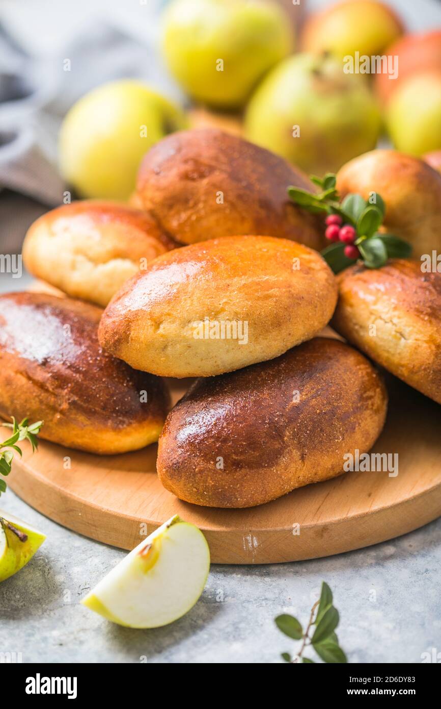 Ready-made baked pies (pirogi) with apple. Traditional russian cuisine ...