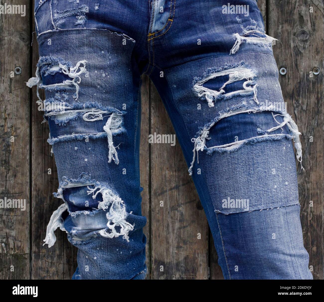 Holes in denim jeans hi-res stock photography and images - Alamy