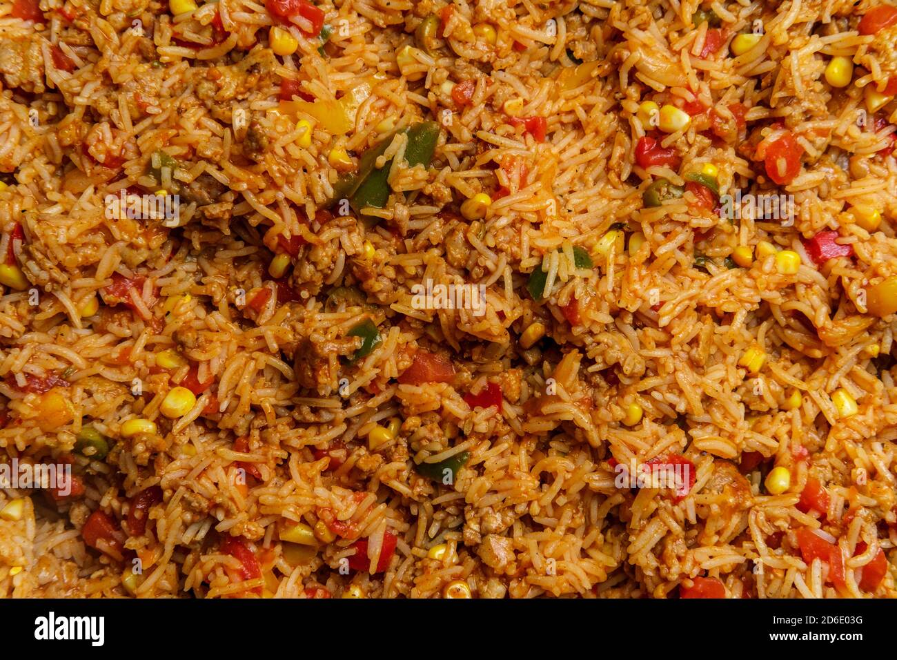 Spanish rice made with sausage mixed peppers onions corn and green ...