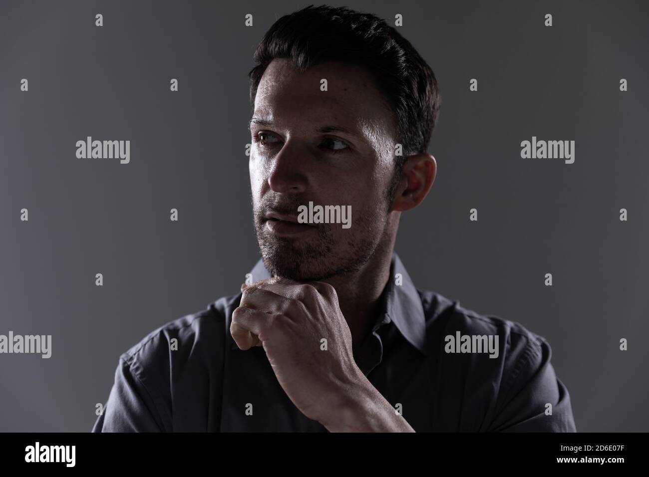 Hand against chin hi-res stock photography and images - Alamy