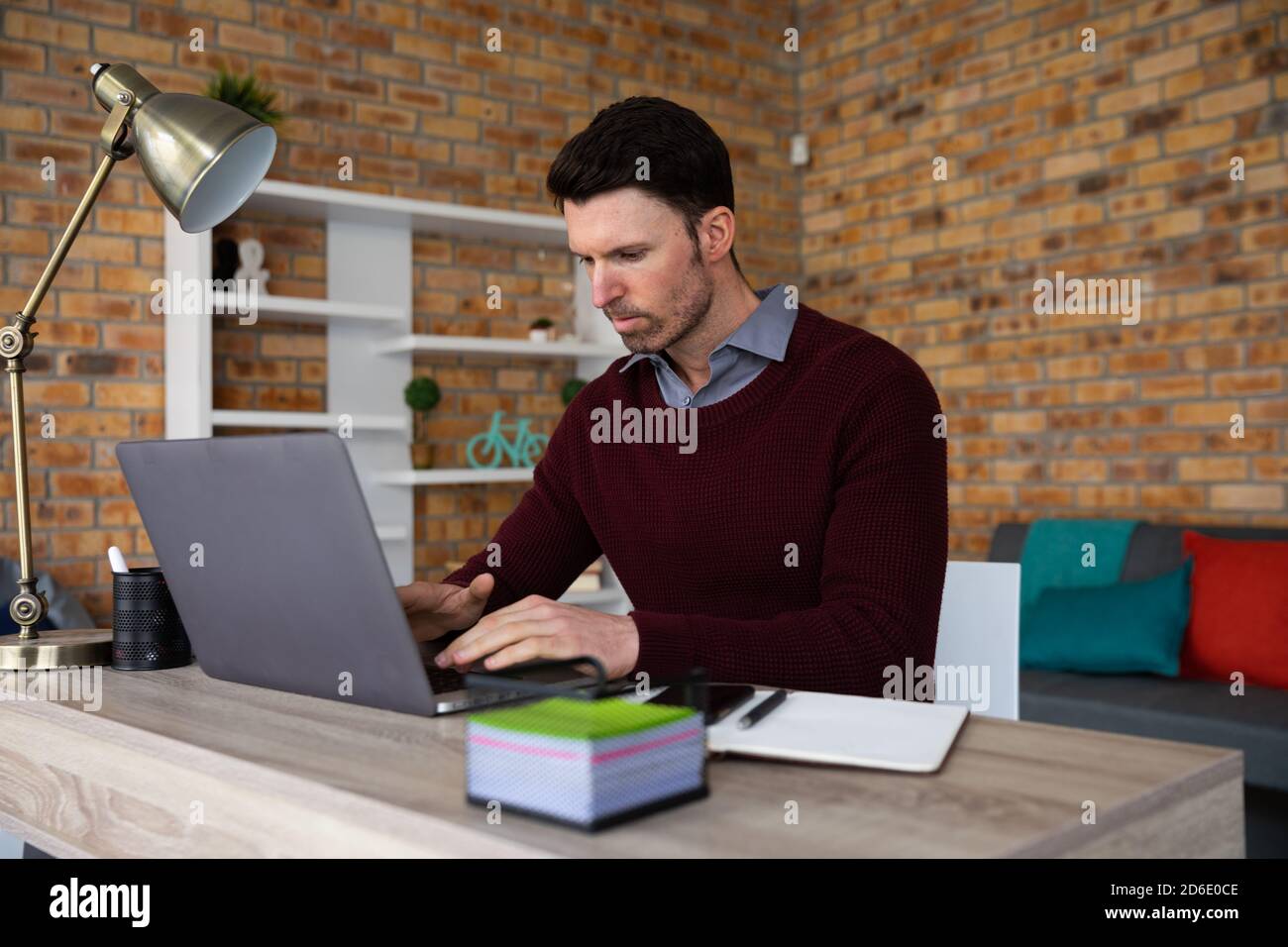 Man sitting desk using laptop hi-res stock photography and images - Alamy