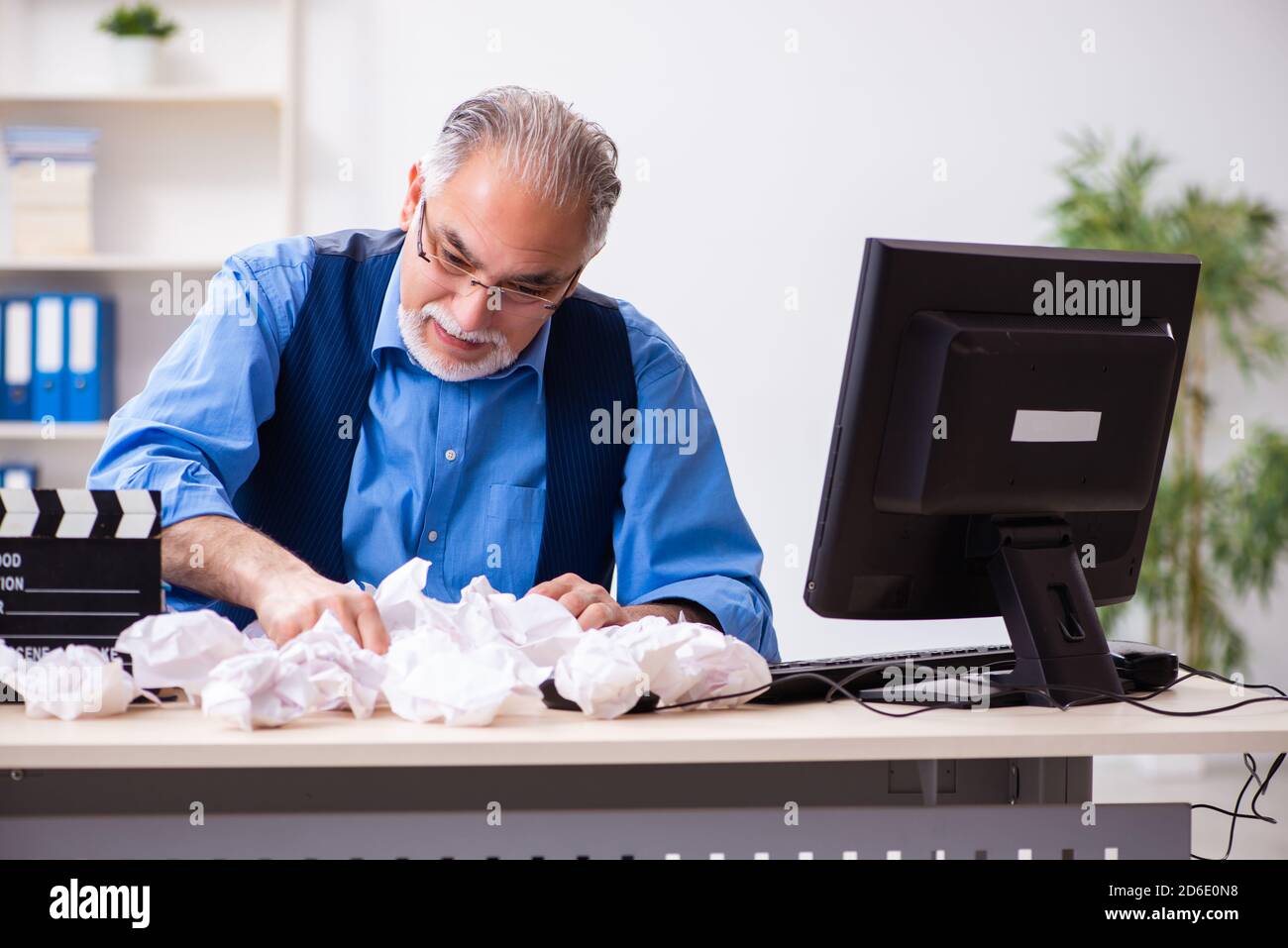 Old male author writing the screenplay Stock Photo - Alamy