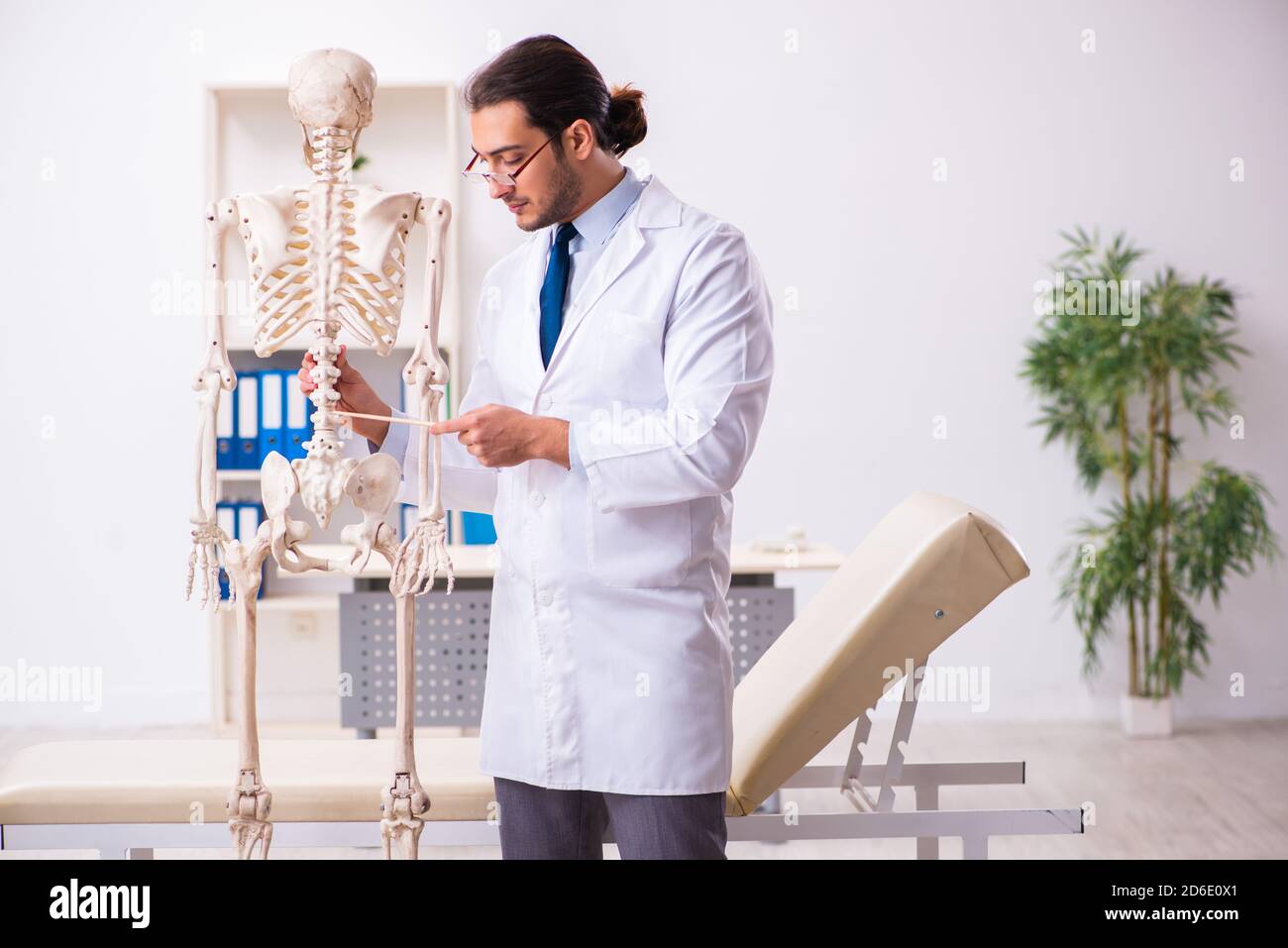 Doctor explaining skeleton spine model hi-res stock photography and ...