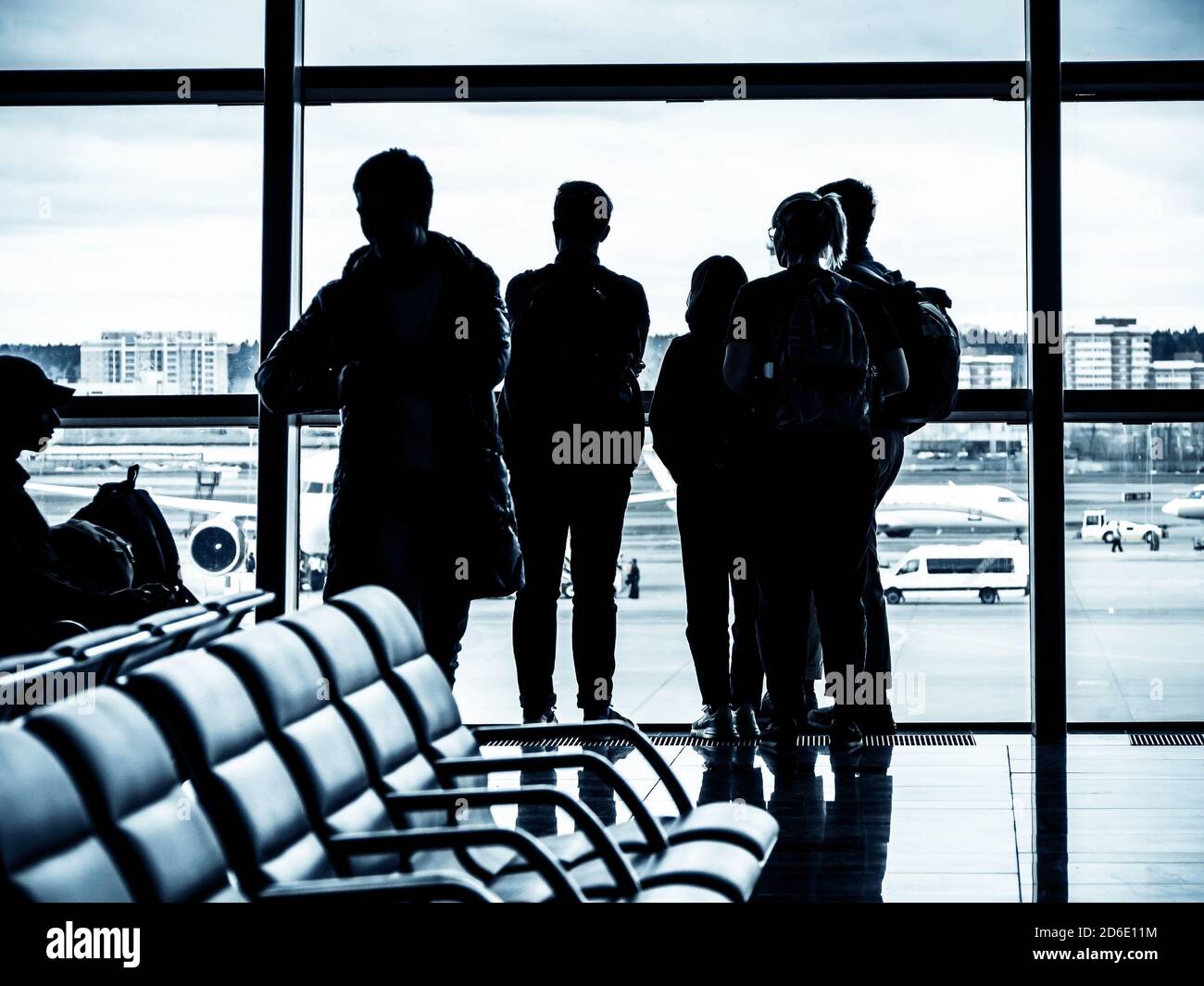 A group of young people at a departure lounge of a modern airport Stock ...