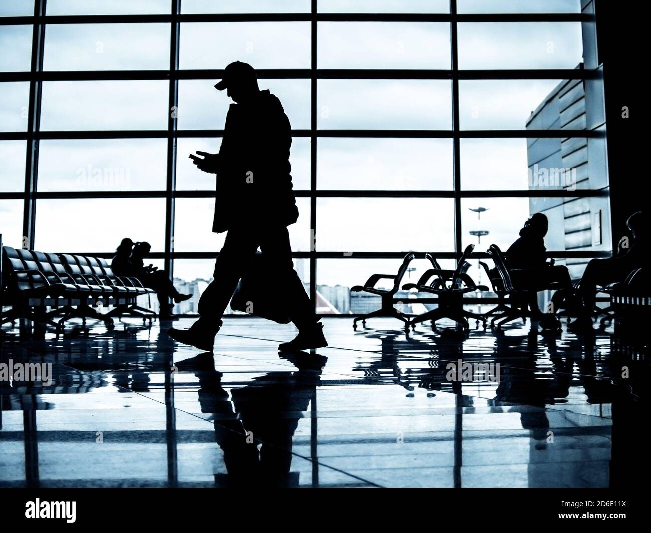 Passengers walking at a departure lounge of a modern airport Stock ...