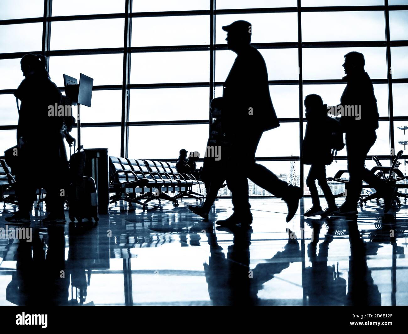 Passengers walking at a departure lounge of a modern airport Stock ...