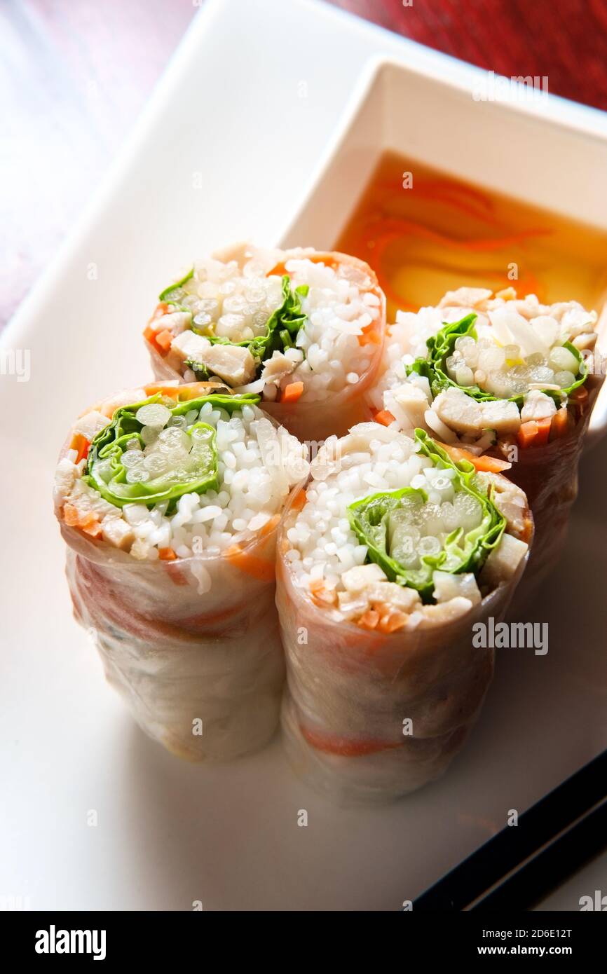 Fresh sliced vietnamese vegetable spring rolls with chicken and sweet ...