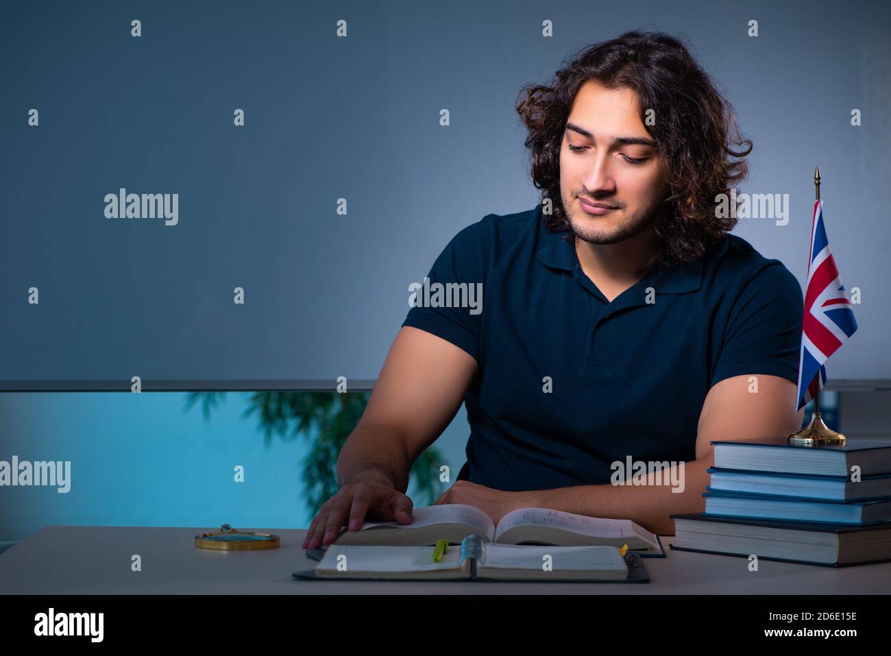 Young student in the classroom at night Stock Photo - Alamy