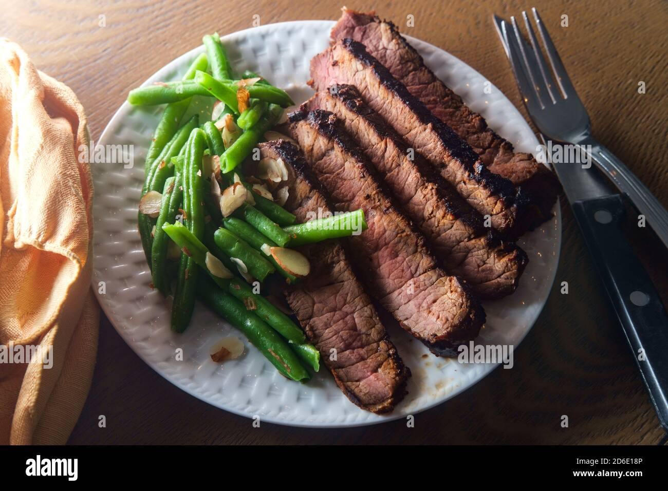 Filet mignon steak dinner with green string beans in almond butter ...