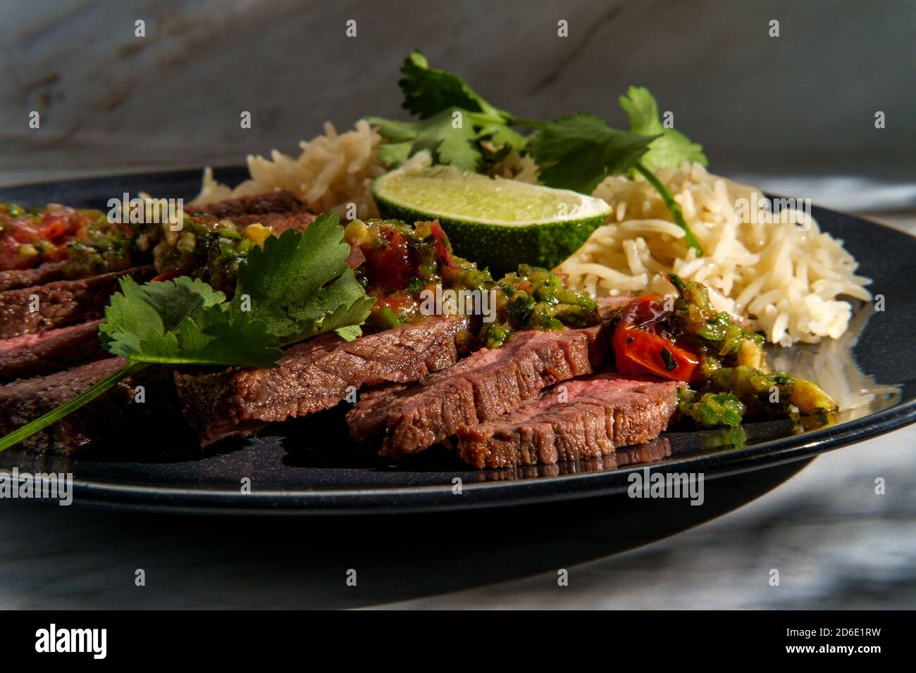 Rib-eye steak cooked rare with hot and spicy Thai crying tiger sauce ...