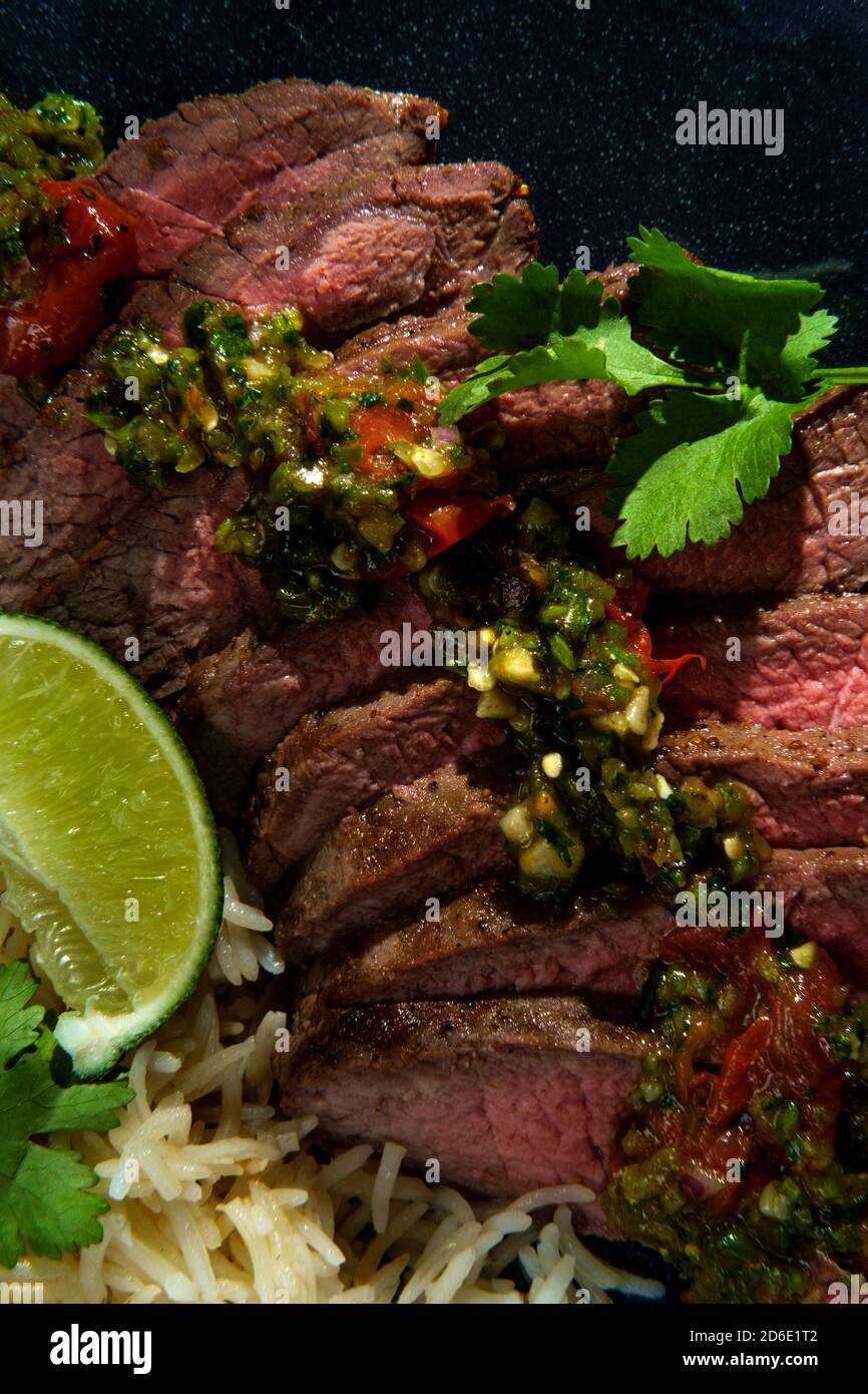 Rib-eye steak cooked rare with hot and spicy Thai crying tiger sauce ...