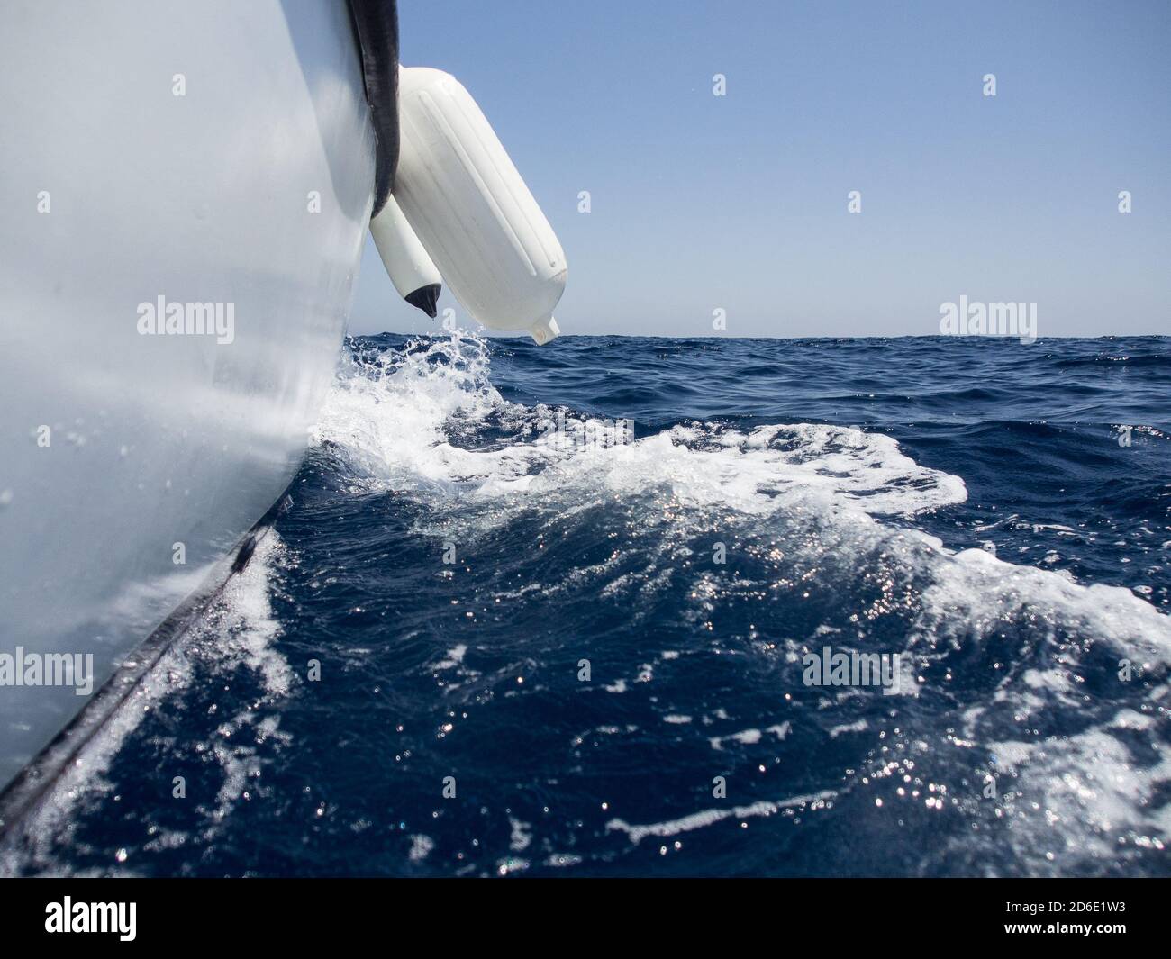 Seawater splashes at the board of a sailing boat Stock Photo - Alamy