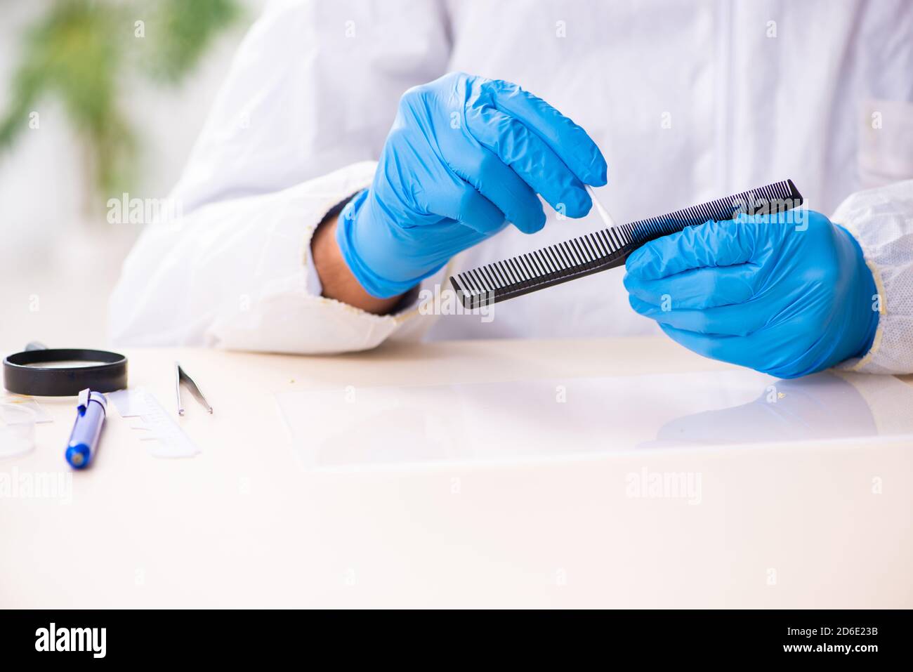 Expert criminologist working in the lab for evidence Stock Photo - Alamy