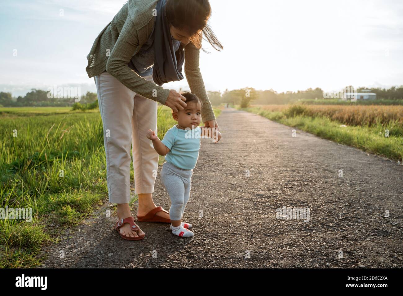 Mom And Baby Holding Hands Walking