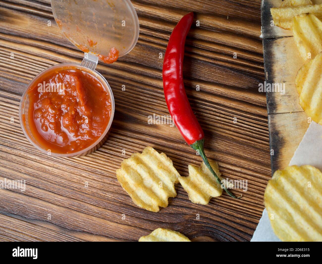 Chili pepper, hot sauce and crisps Stock Photo - Alamy