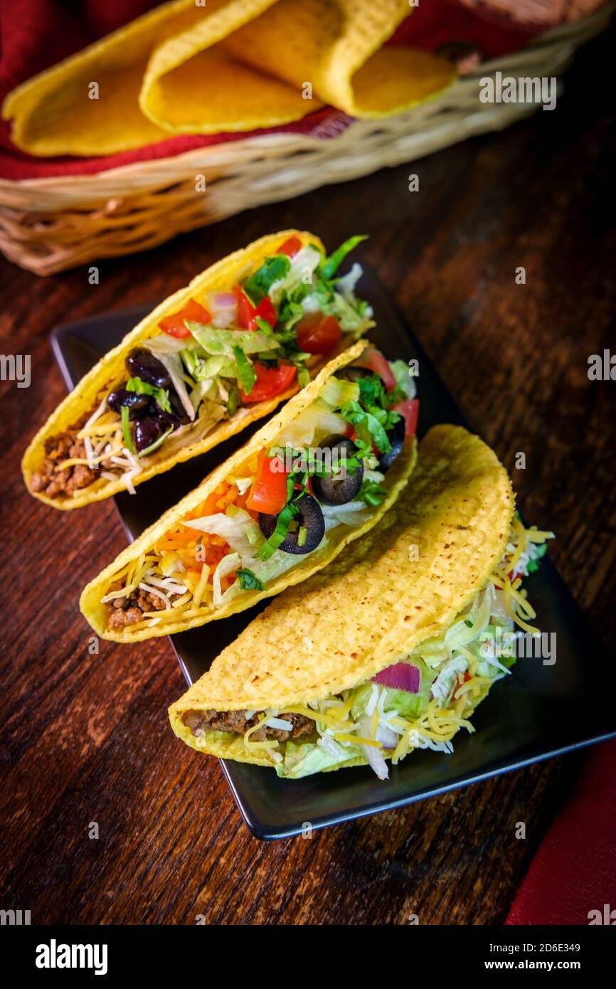 Mexican beef tacos loaded with toppings including olives shredded ...