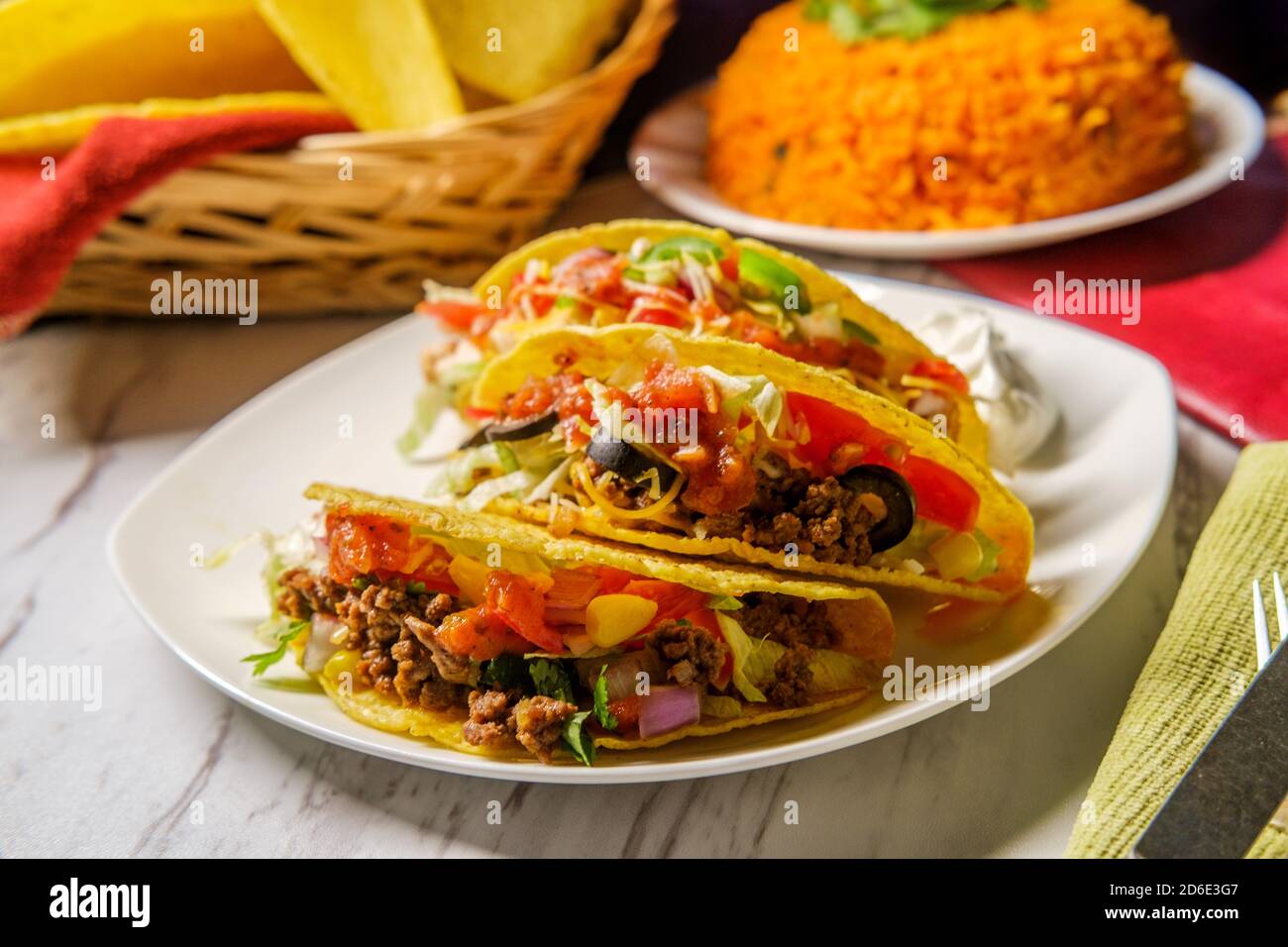 Mexican beef tacos loaded with toppings including olives shredded ...