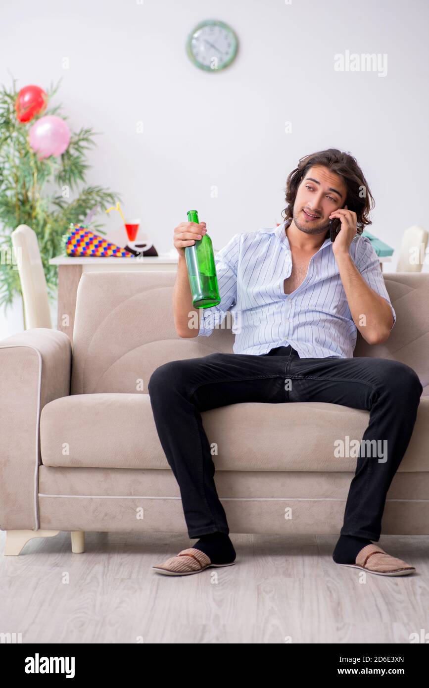 The young man celebrating his birthday at home Stock Photo - Alamy