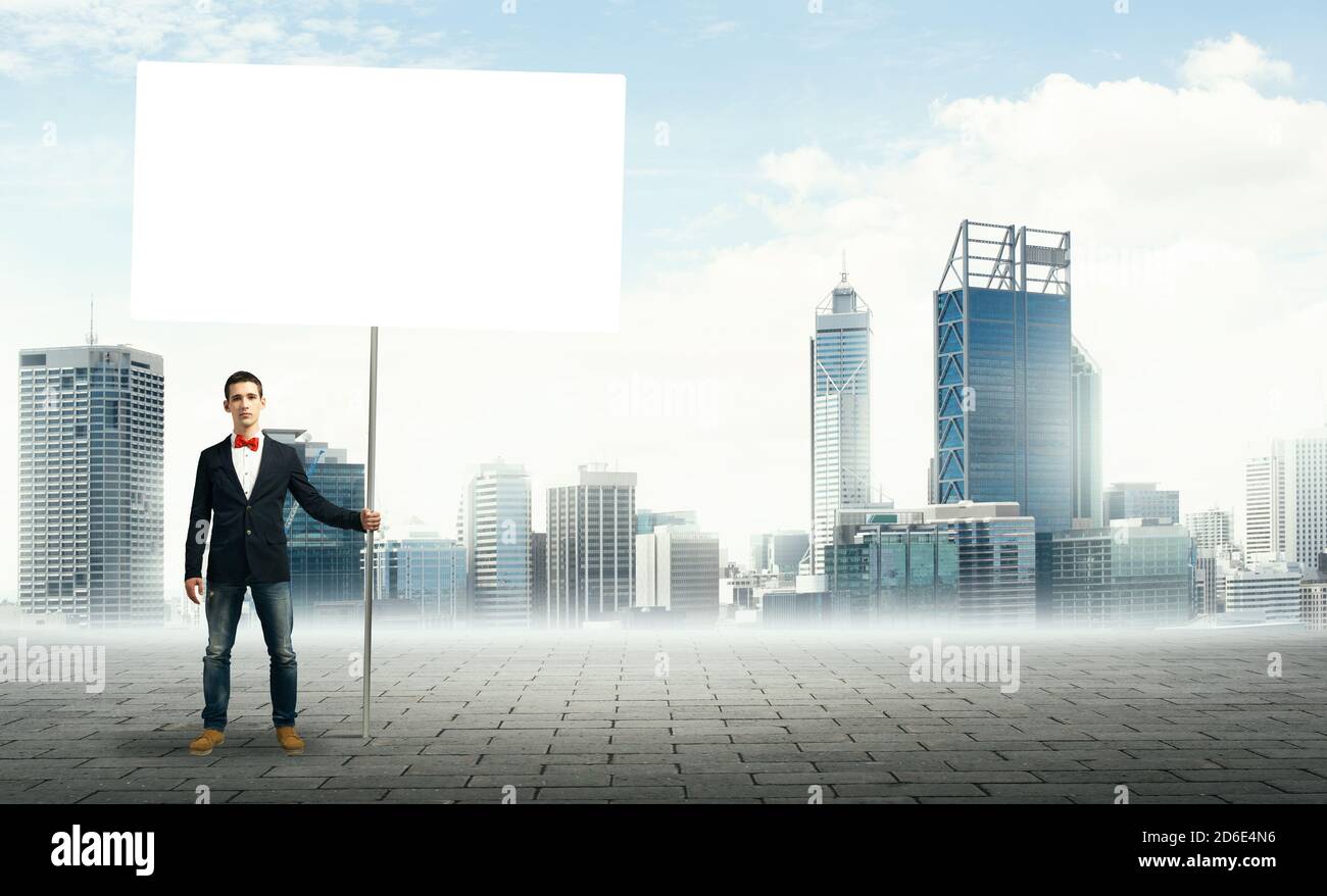 Guy with white billboard Stock Photo - Alamy