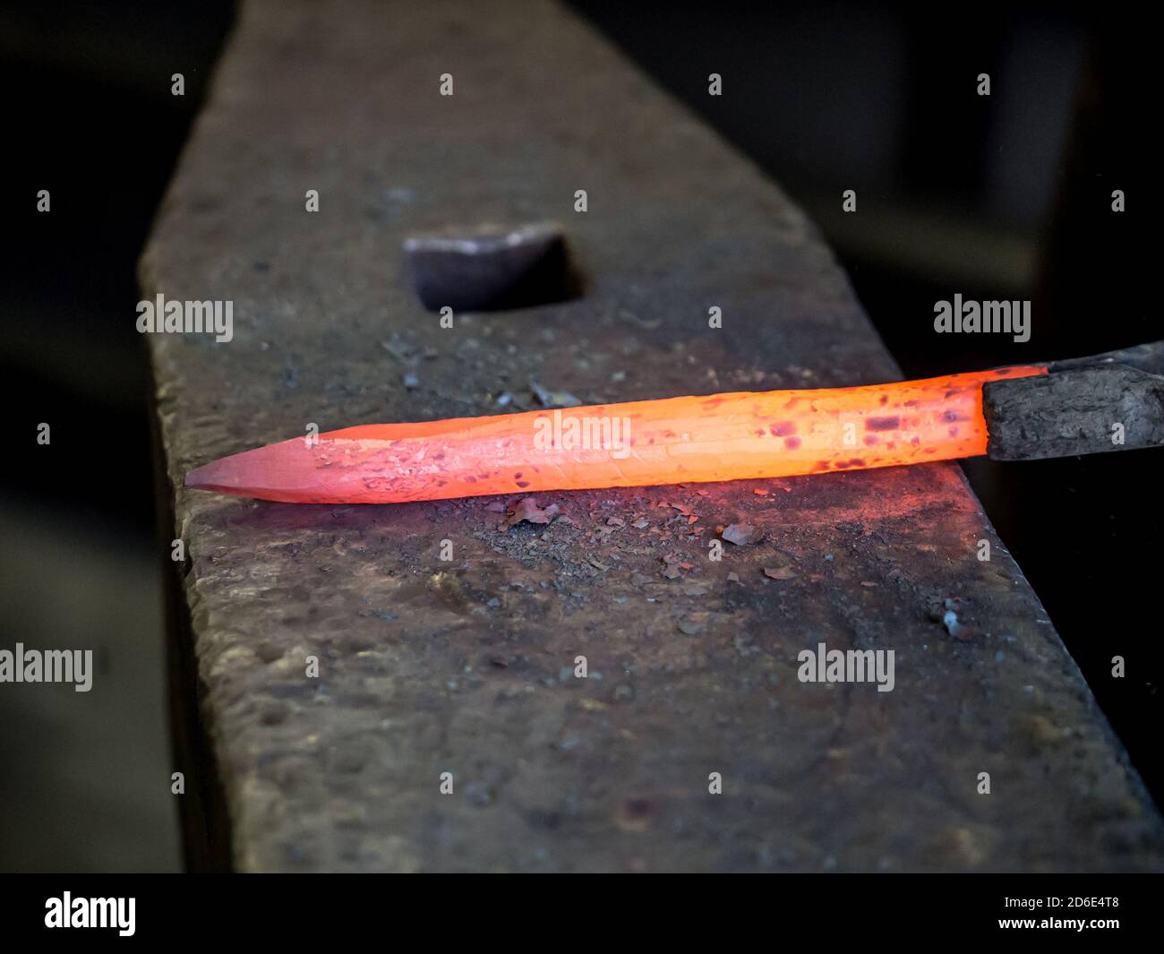 Rod of red hot forging steel at the blacksmith's Stock Photo - Alamy
