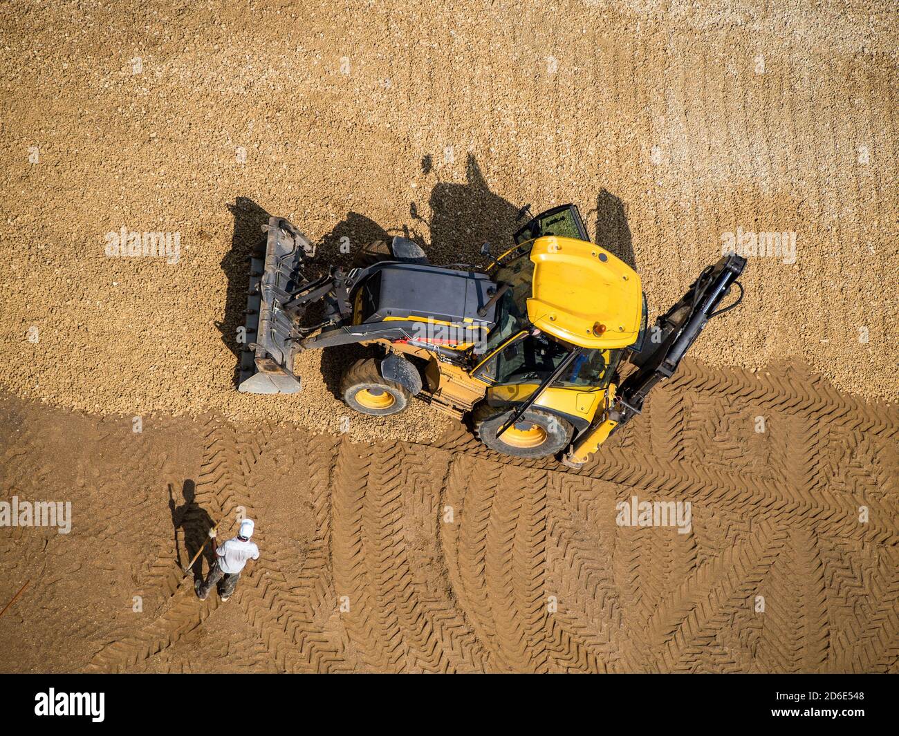 Wheeled loader in action at a road construction site Stock Photo - Alamy
