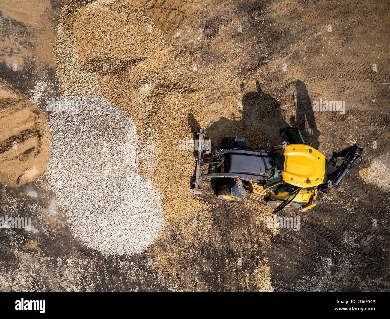 Wheeled loader in action at a road construction site Stock Photo - Alamy