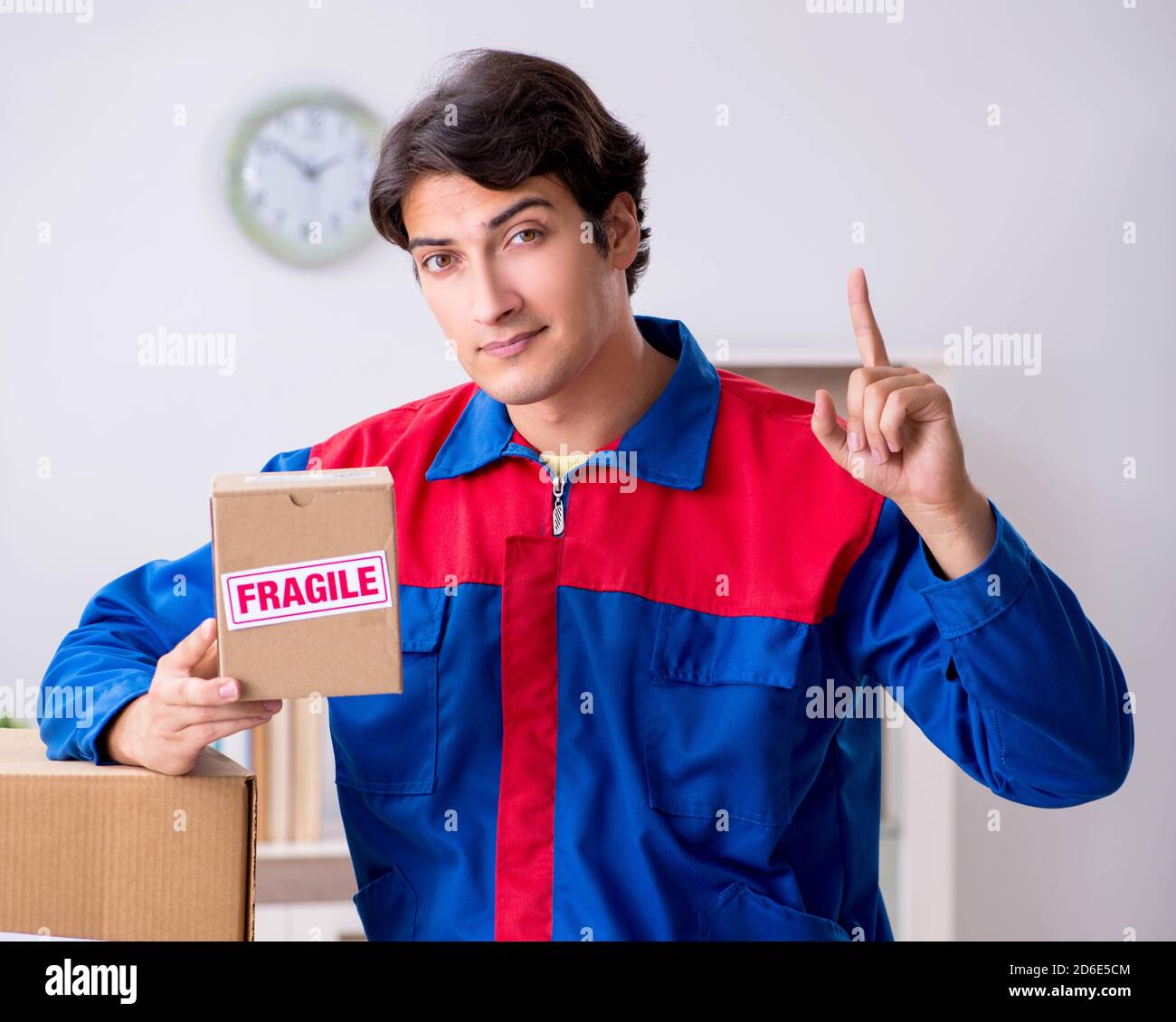 The transportation contractor with fragile boxes Stock Photo - Alamy