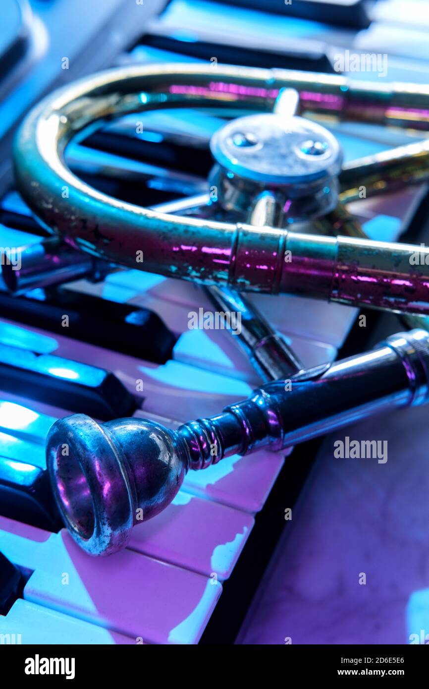 Old and worn Jazz slide trombone and piano keyboard musical show and ...