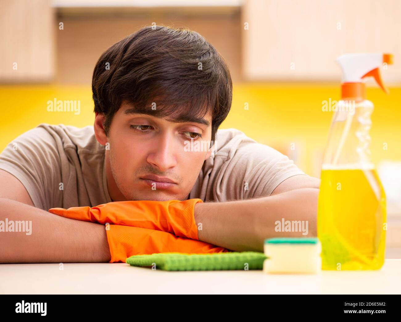 The single man cleaning kitchen at home Stock Photo - Alamy
