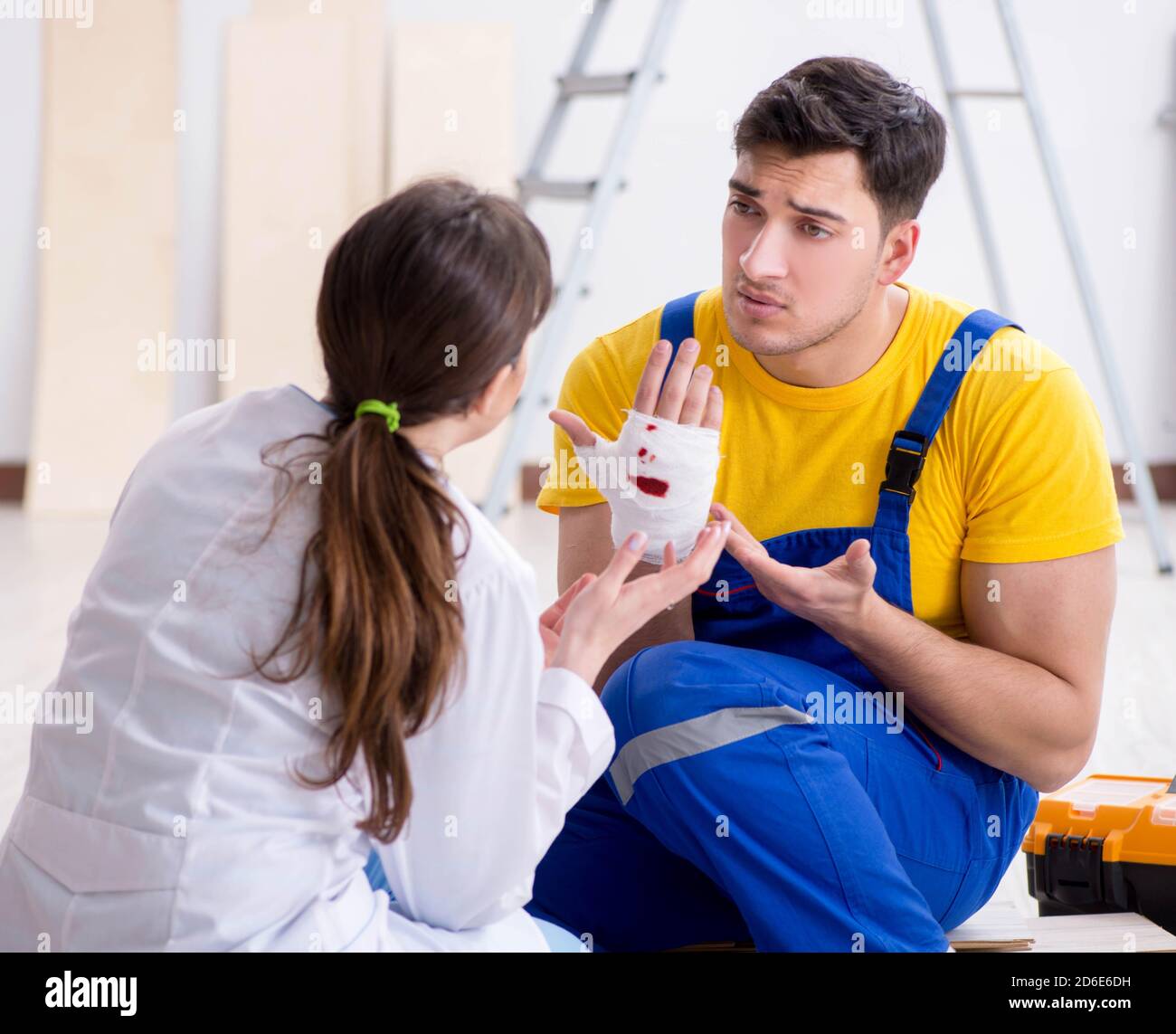 Injured man assisted doctor hi-res stock photography and images - Alamy