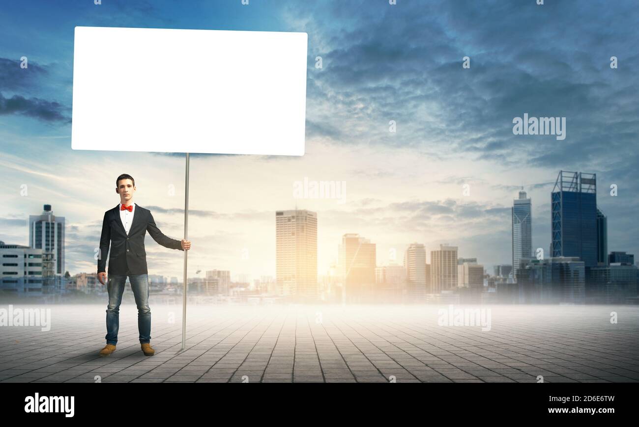 Guy with white billboard Stock Photo - Alamy