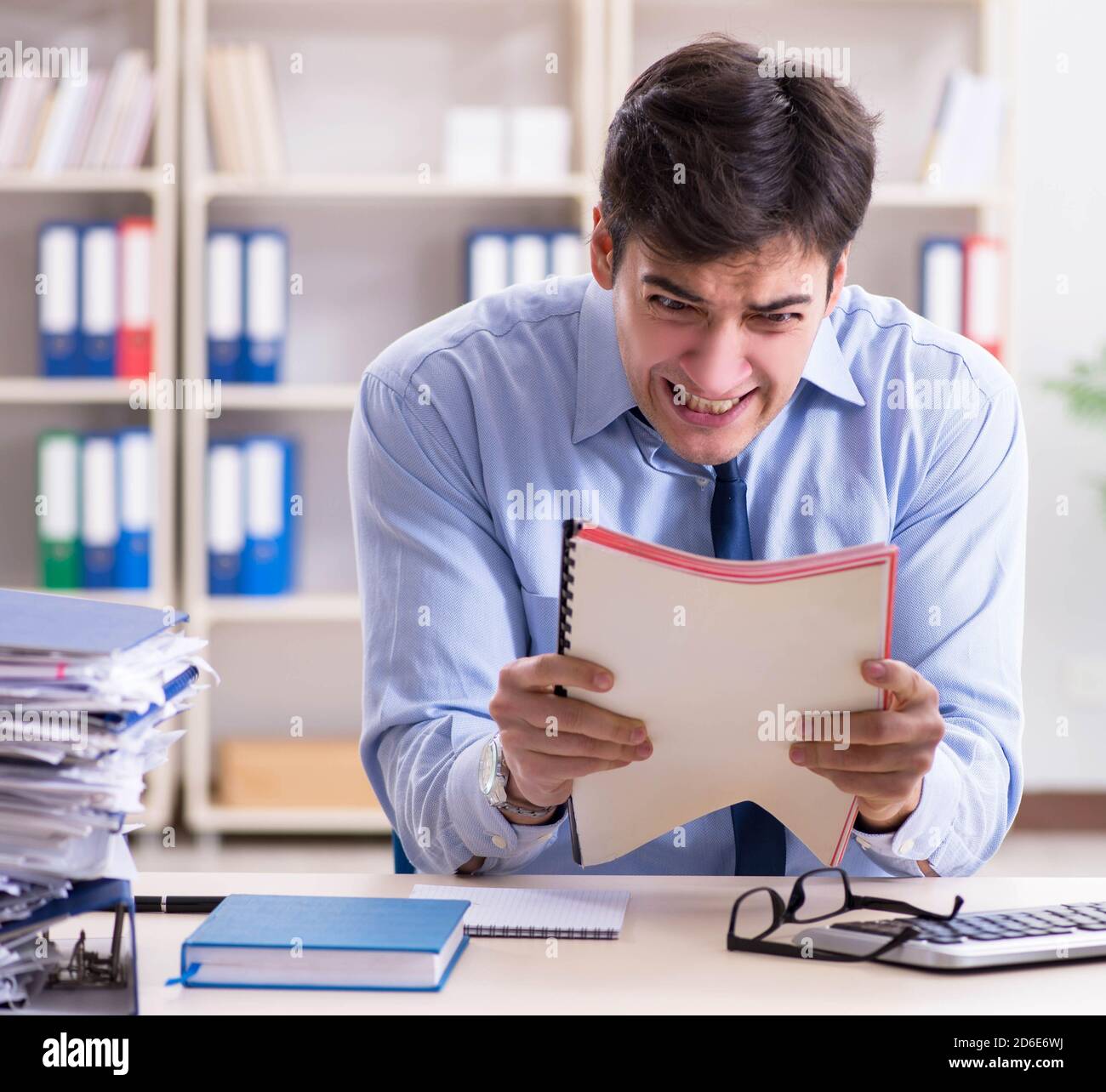 The tired businessman with too much paperwork Stock Photo - Alamy