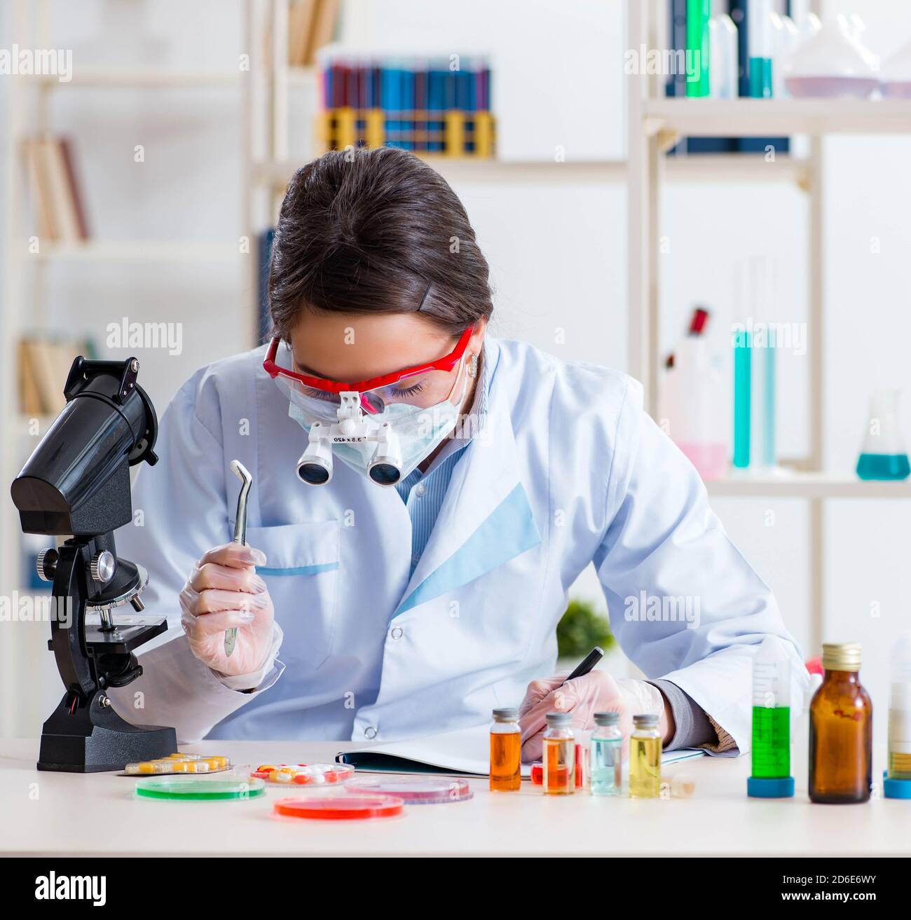 The lab assistant in drug synthesis concept Stock Photo - Alamy