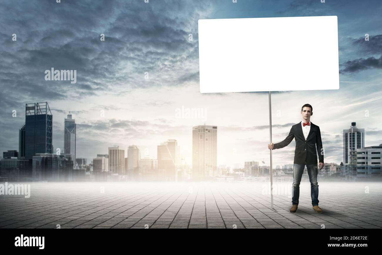 Guy with white billboard Stock Photo - Alamy
