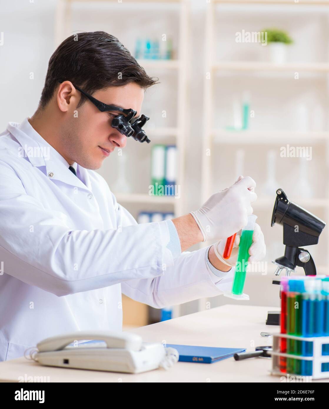The young chemical scientist working in lab Stock Photo - Alamy