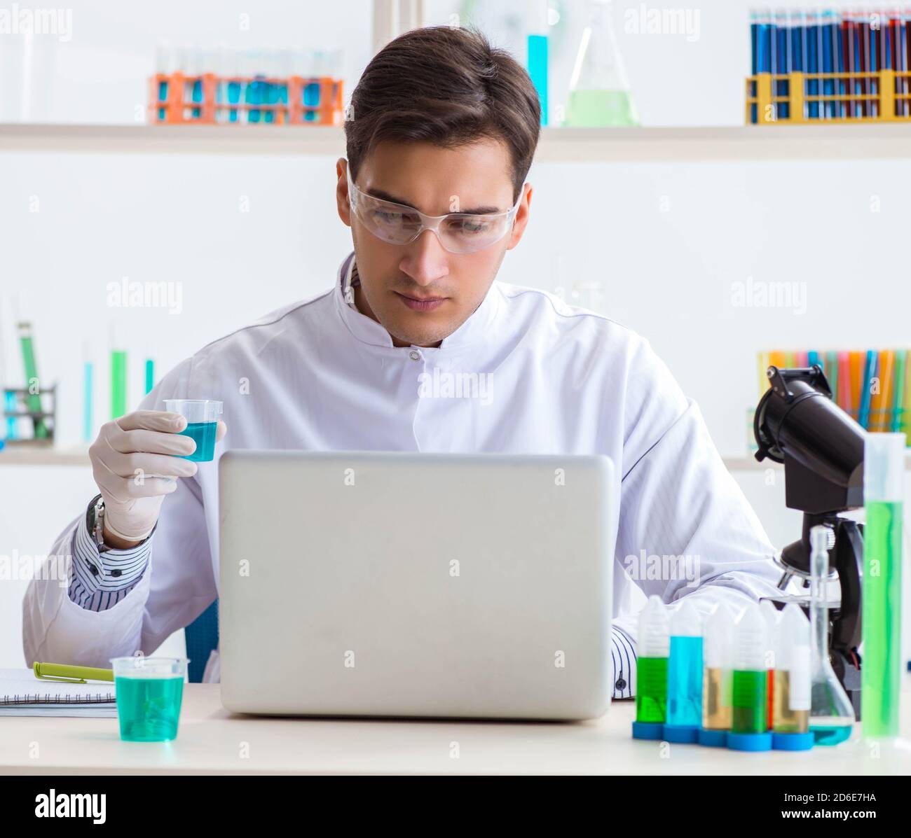 The man student working in chemical lab on experiment Stock Photo - Alamy