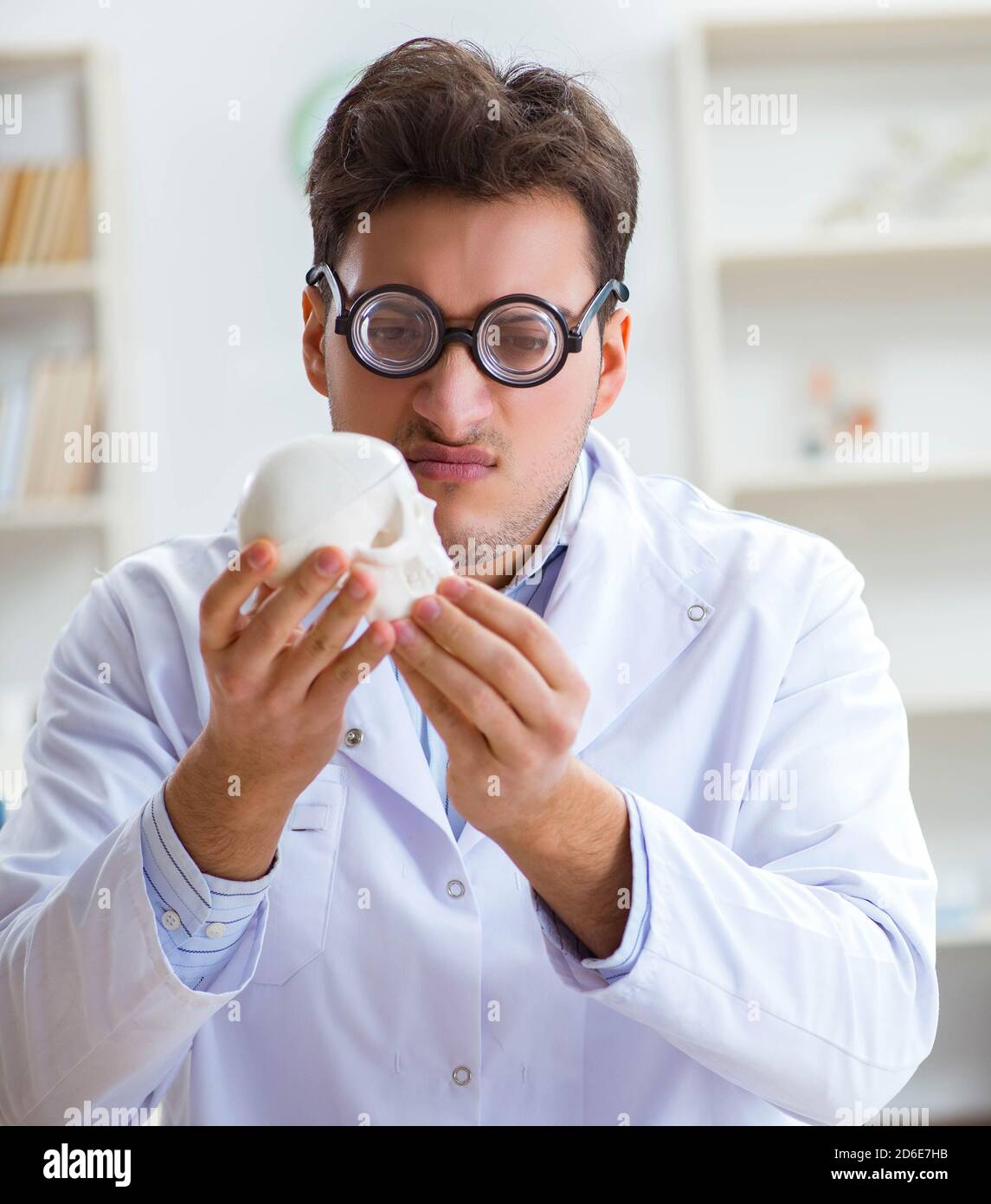 The crazy doctor studying human skeleton Stock Photo - Alamy