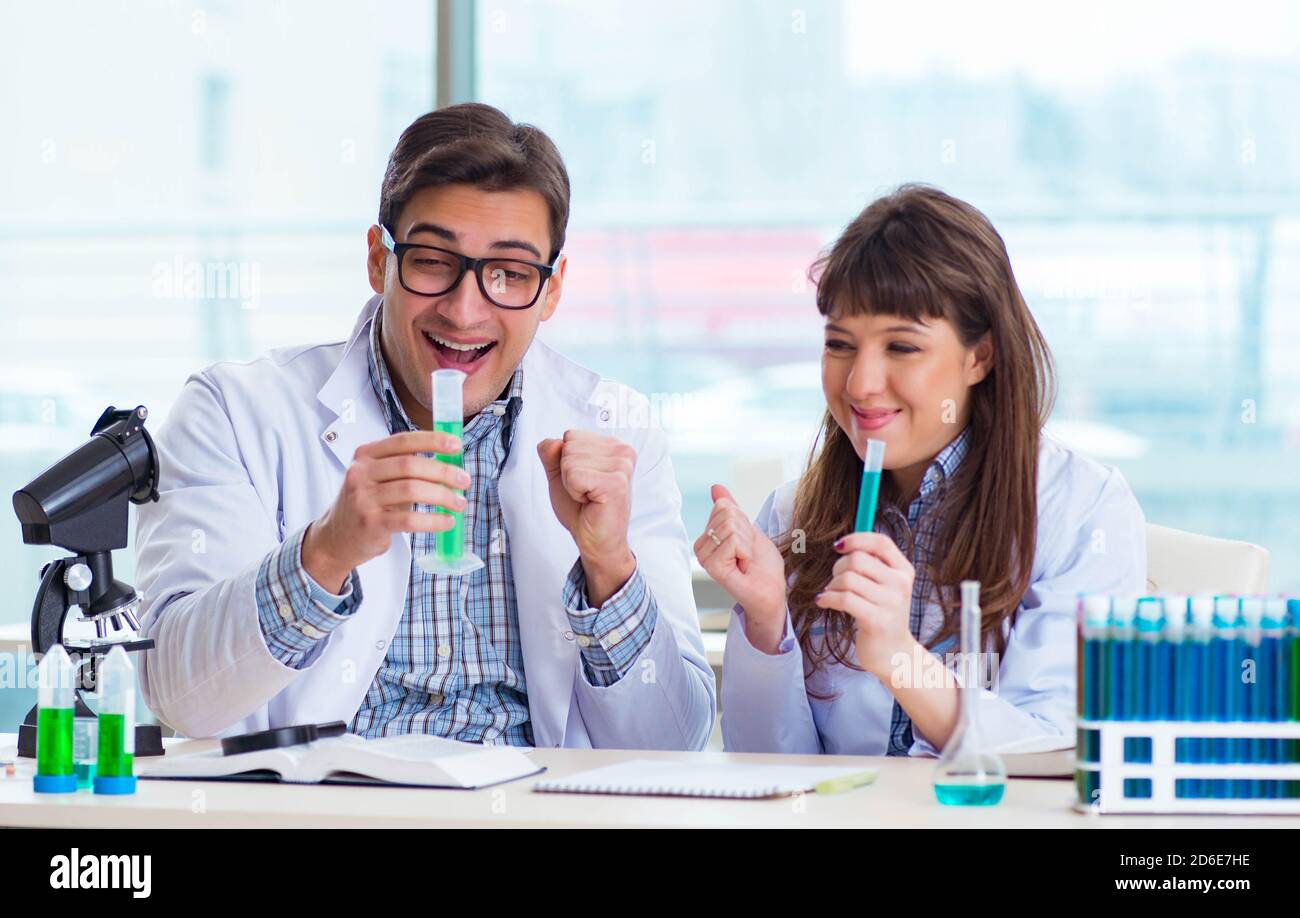 The two chemists working in lab experimenting Stock Photo - Alamy