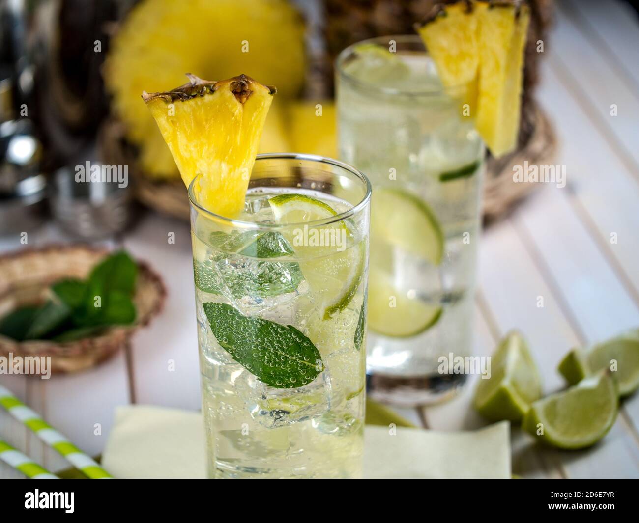 Freshly made pineapple mojito with ingredients setting Stock Photo - Alamy