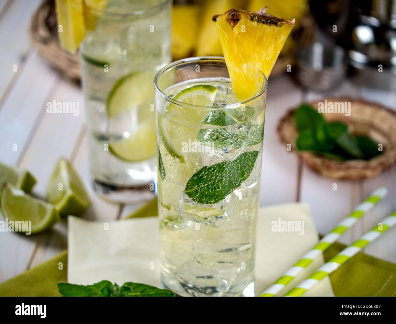 Freshly made pineapple mojito with ingredients setting Stock Photo - Alamy