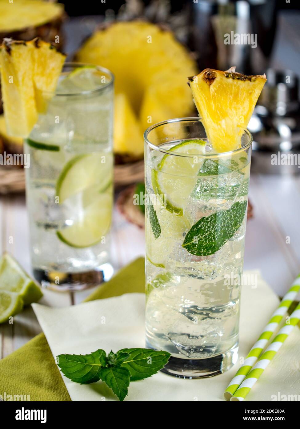 Freshly made pineapple mojito with ingredients setting Stock Photo - Alamy